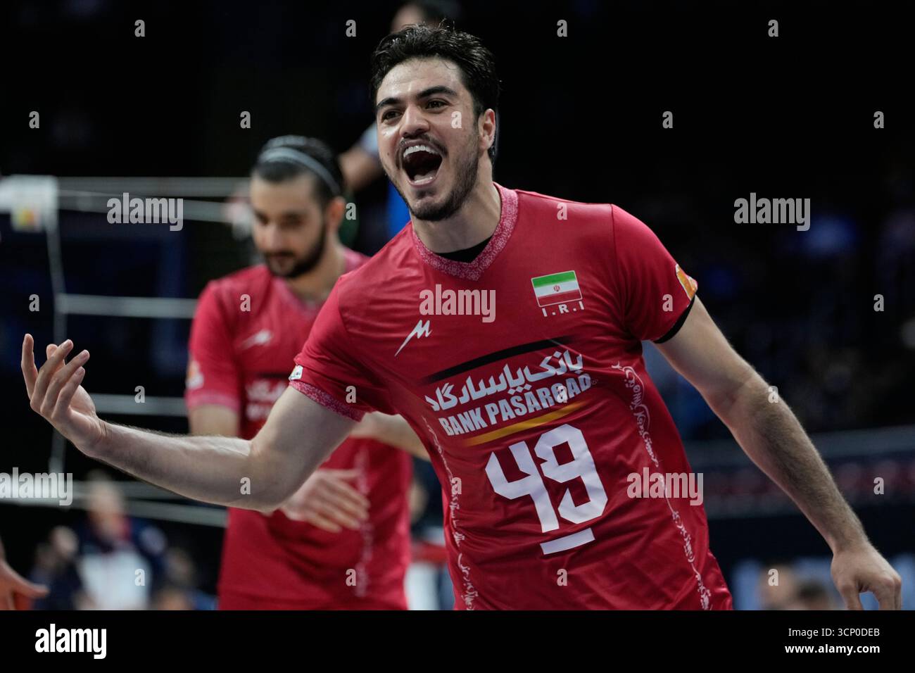 Morteza Sharifi of Iran celebrates after scoring against Serbia during ...