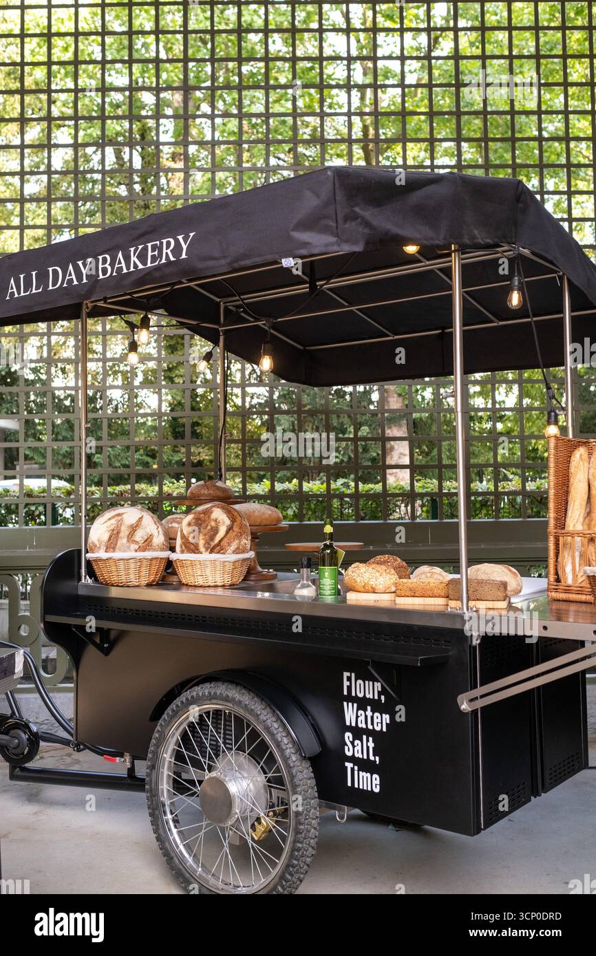 Freshly baked sourdough bread in a wicker basket at a reception event ...