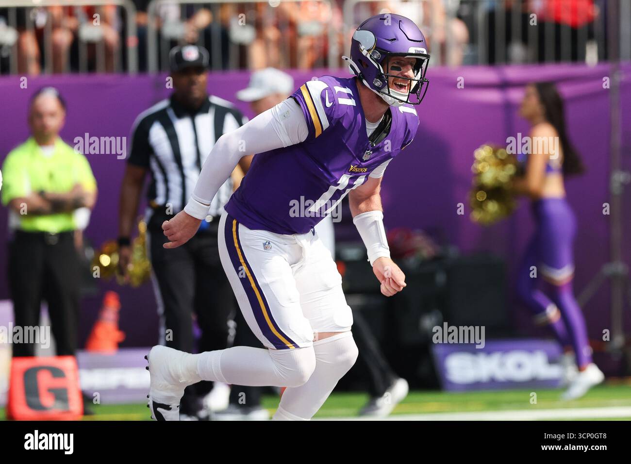 Minnesota Vikings quarterback Carson Wentz (11) smiles after running ...