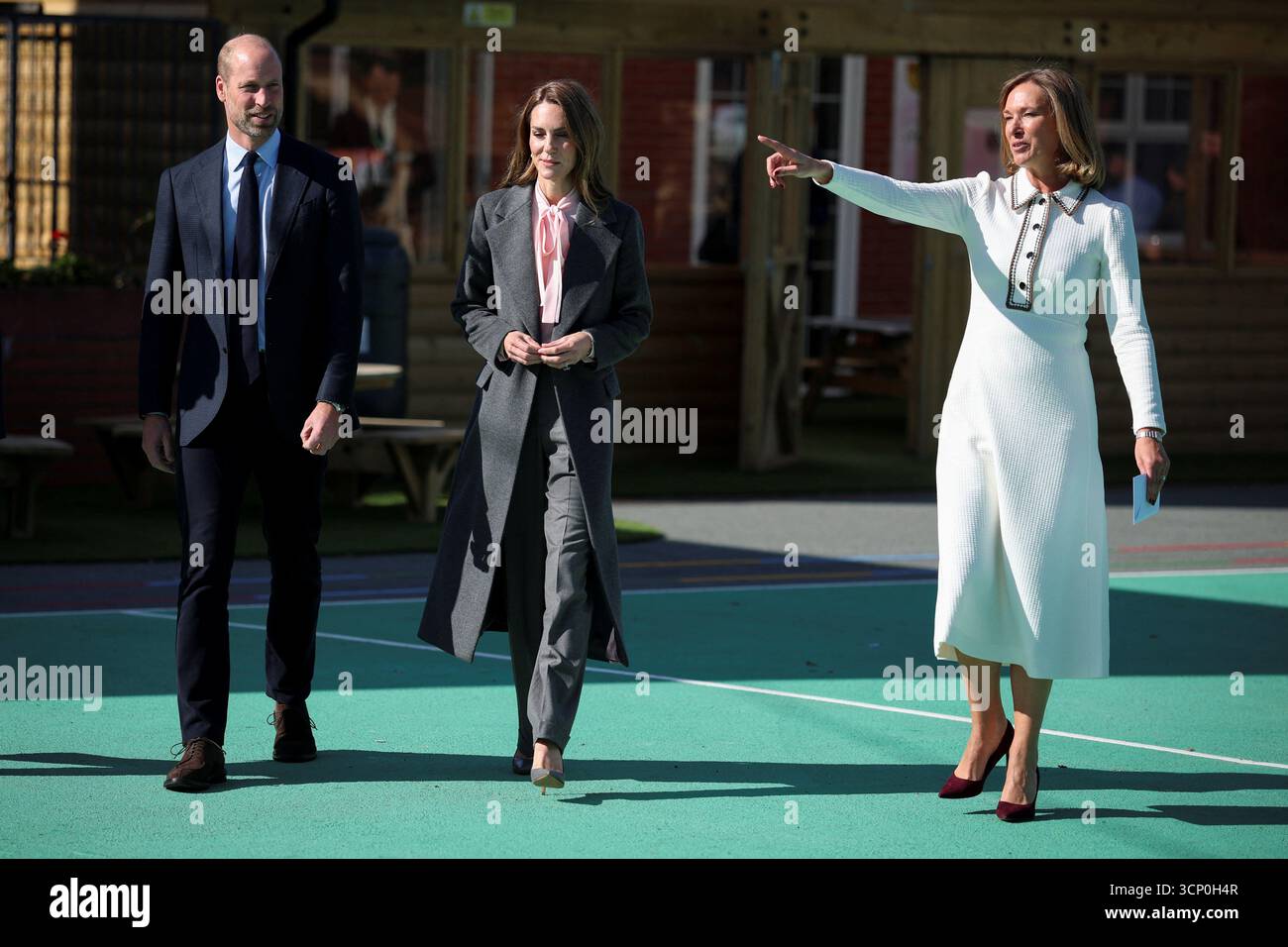 Britain's Prince William and Kate, Princess of Wales, center, visit ...