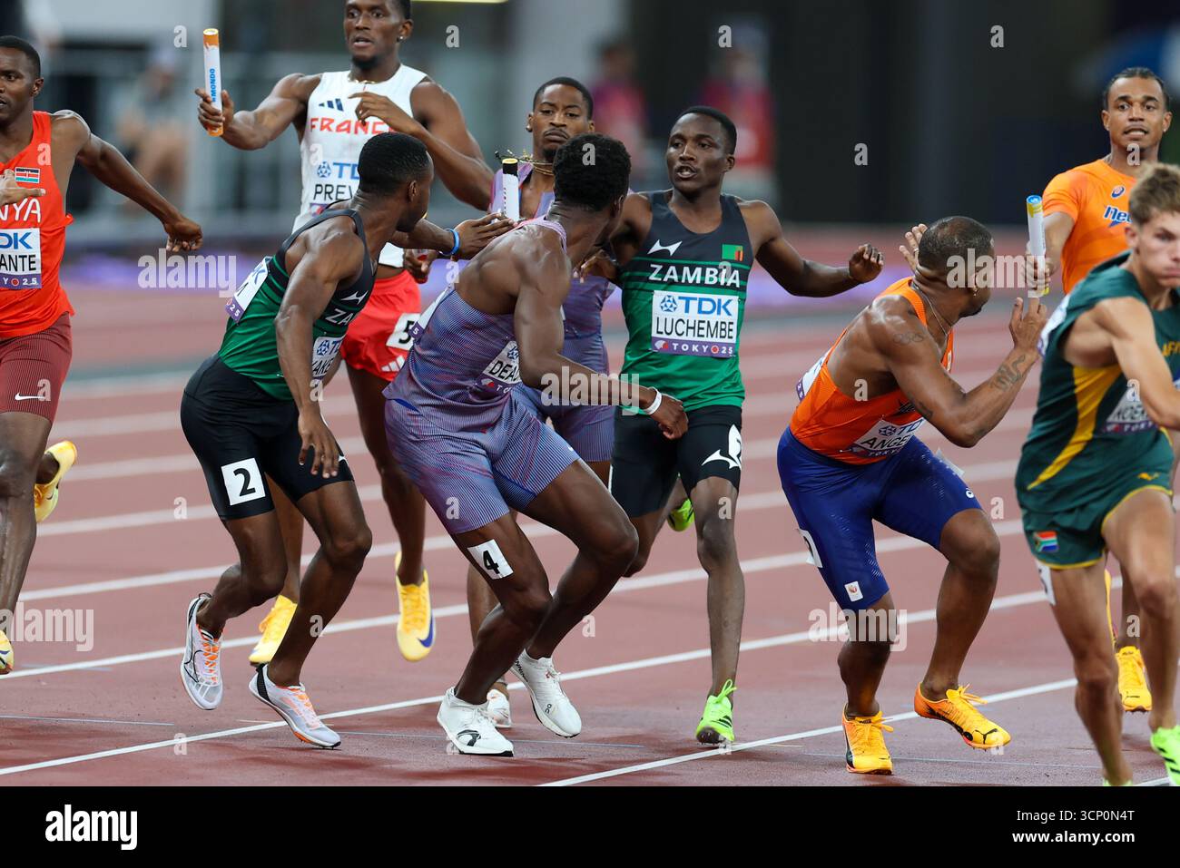 Demarius Smith (USA) attempts to hand the baton off to Bryce Deadmon ...