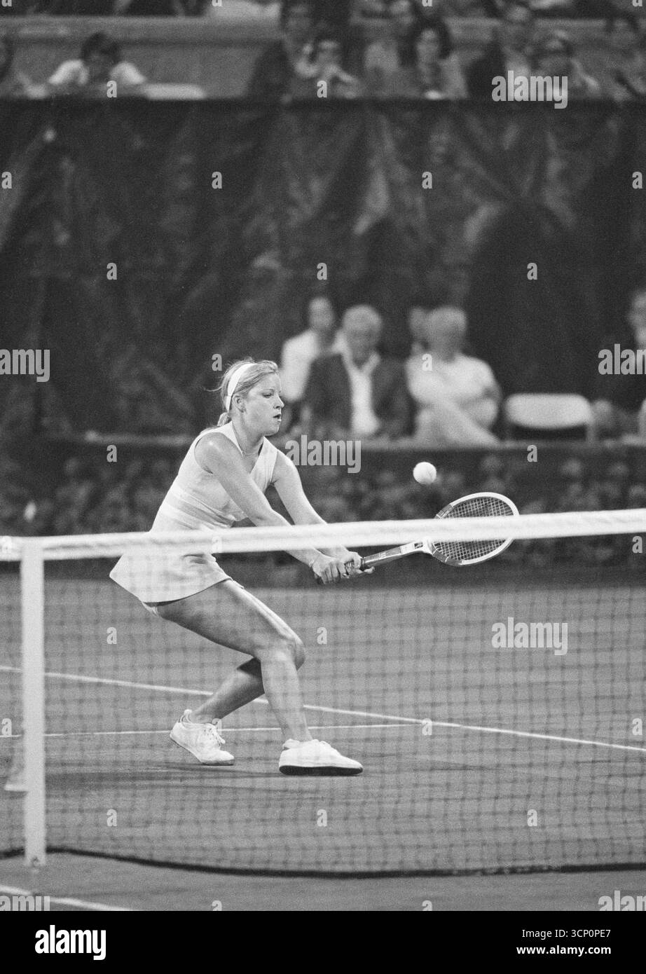 Chris Evert reaches to make one of her famous two-handed backhand ...