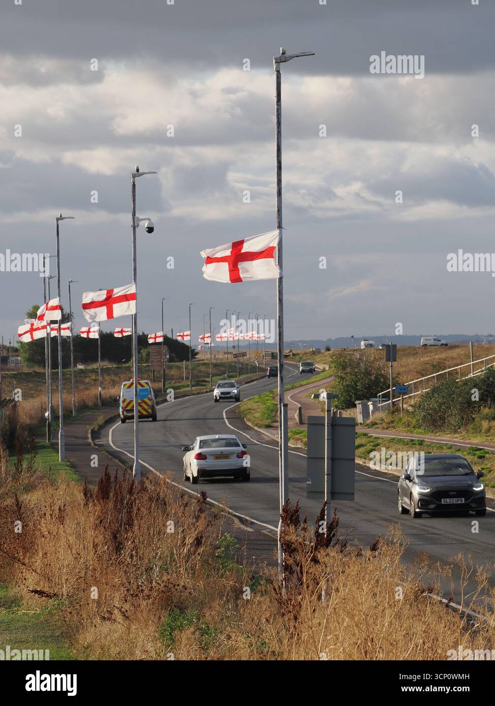 Sheerness, Kent, UK. 23rd Sep, 2025. The long line of St George flags ...