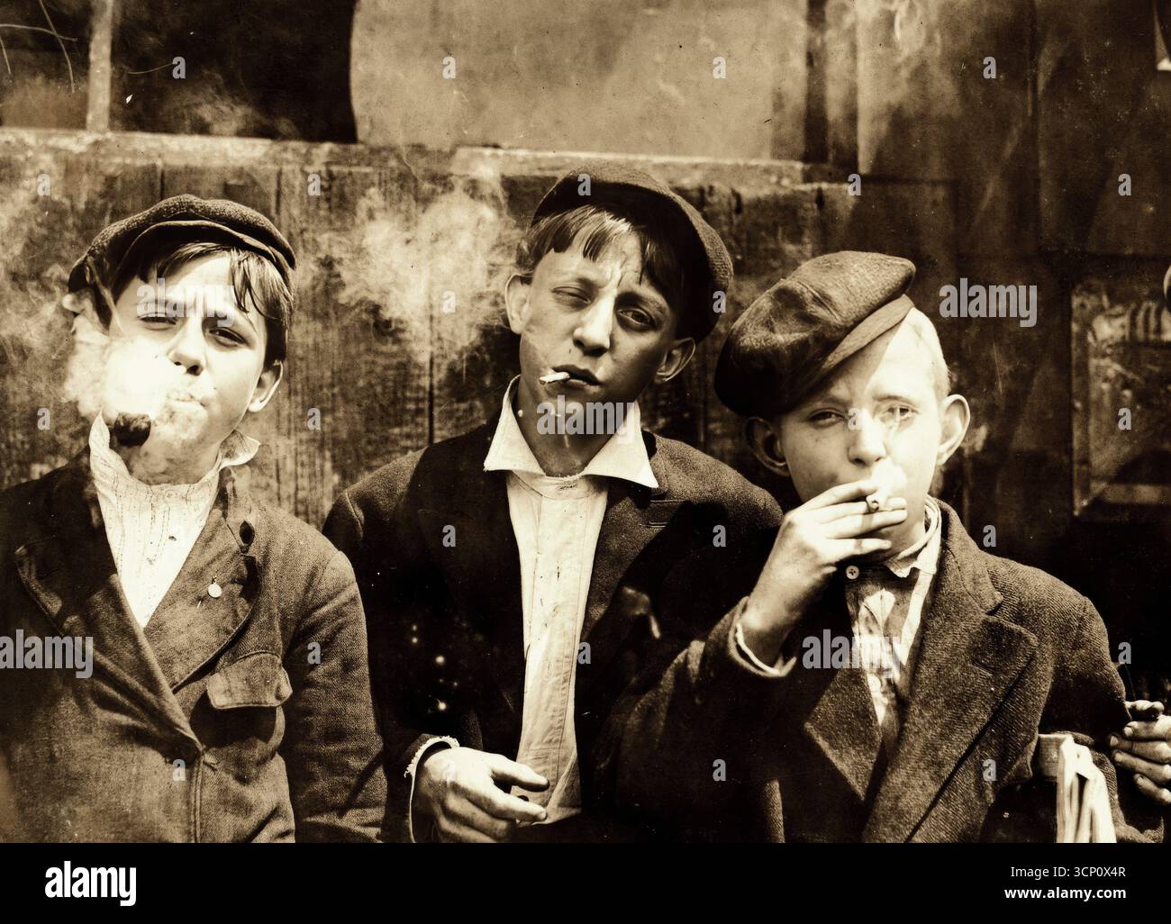 Newsies smoking at Skeeter's Branch, St. Louis, 1910 - Lewis Hine (1874 ...