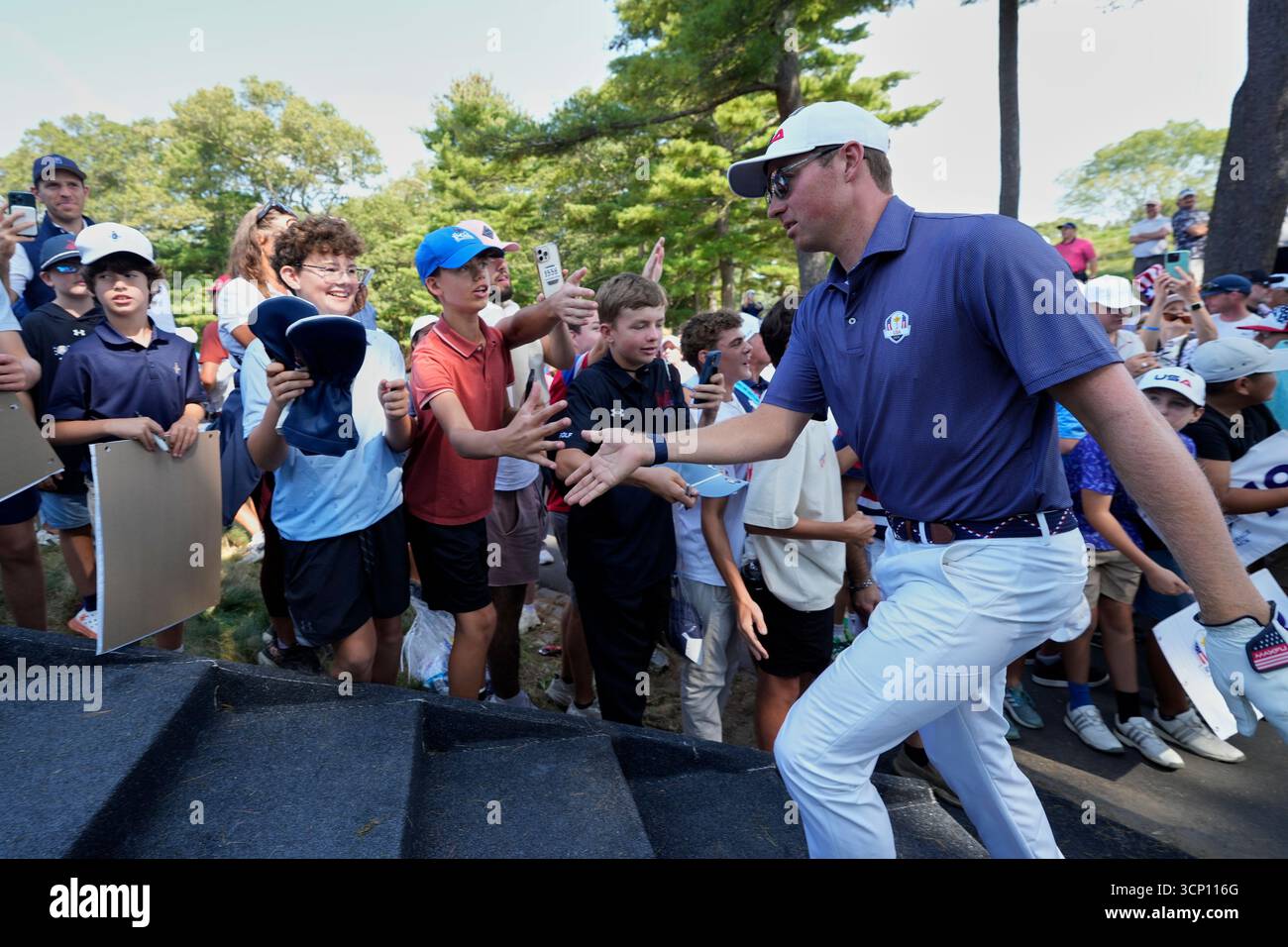 United States' Ben Griffin greets fans on the 14th hole during a ...