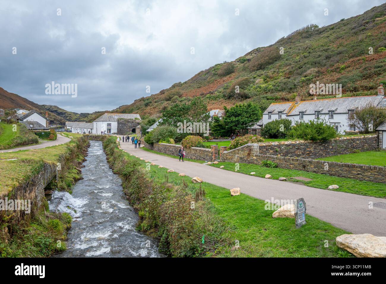 The small Cornish fishing village of Boscastle with white washed stone ...
