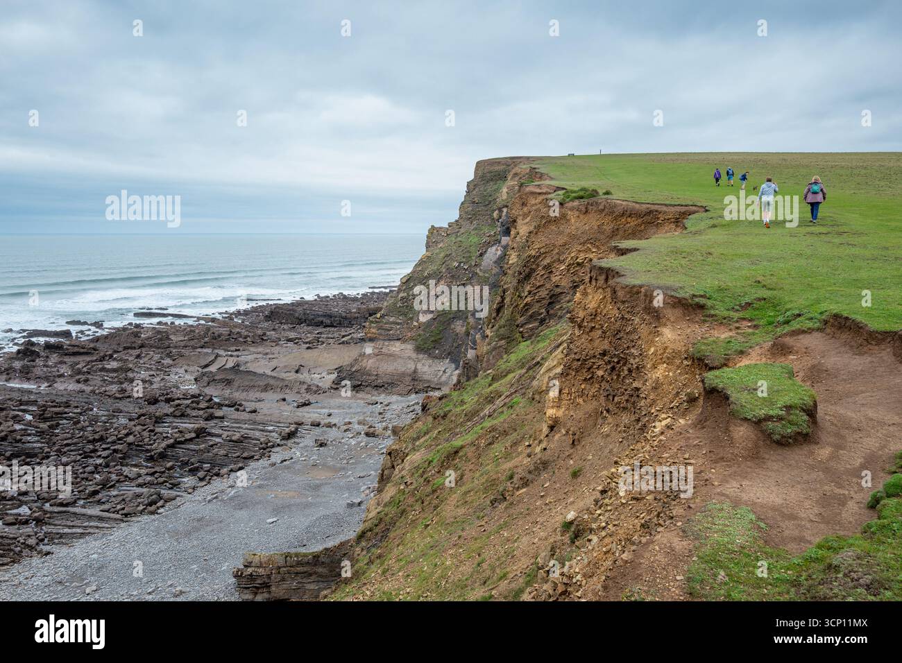 Land erosion and rock formation exposed layers of sandstone and ...