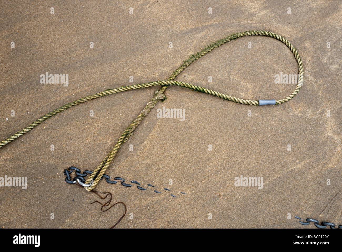 Steel chain and nylon rope used for mooring boats and vessels exposed ...