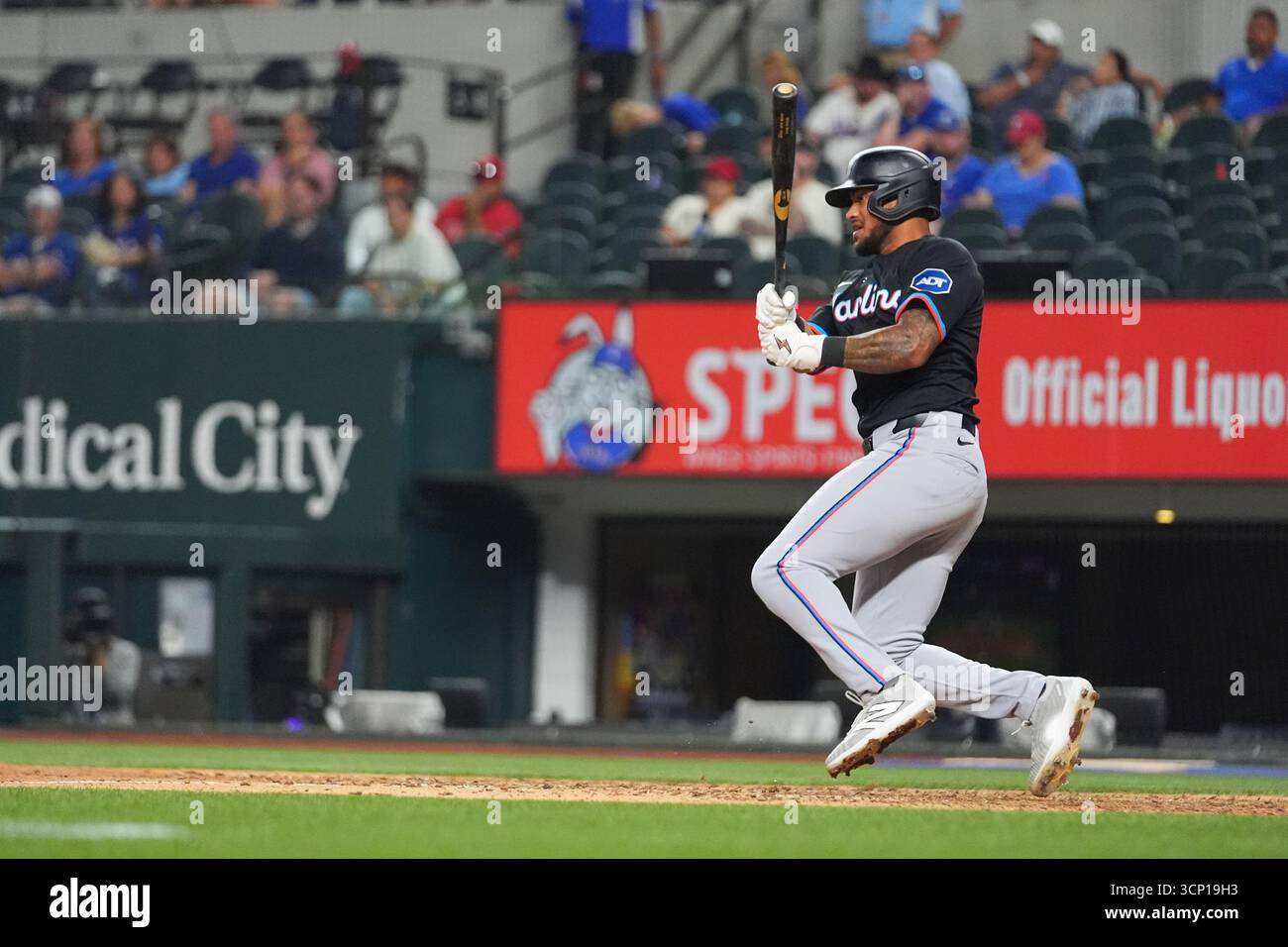 Miami Marlins' Dane Myers follows through on a swing against the Texas ...