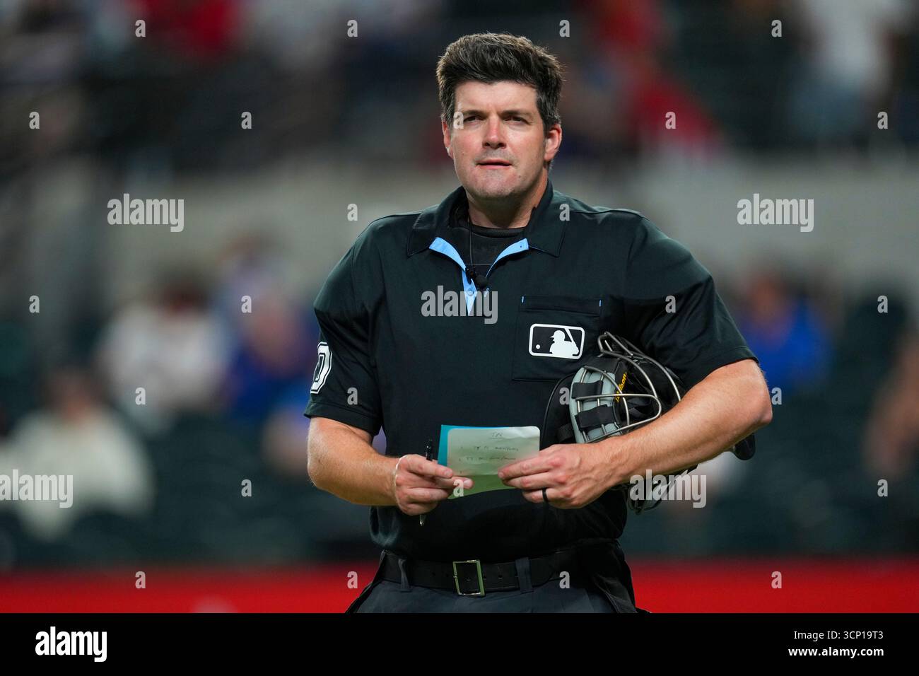 Home plate umpire John Bacon looks on during the 10th inning of a ...