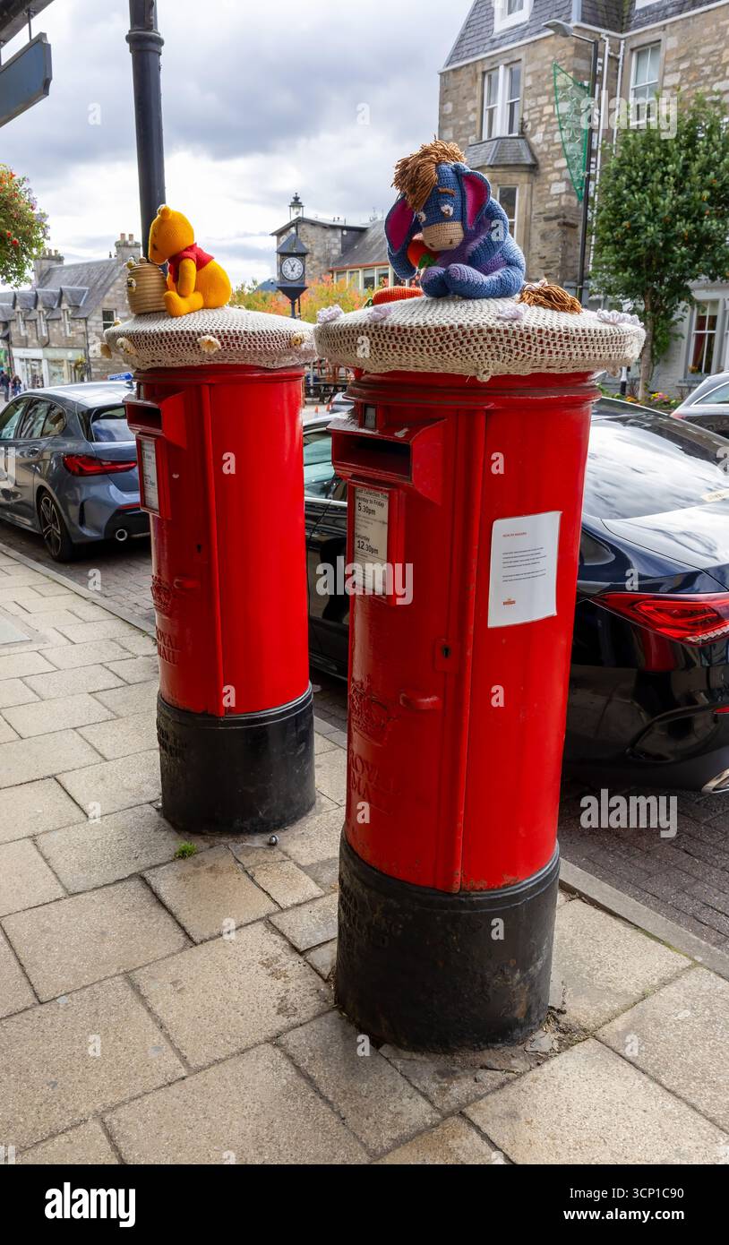 Winnie the poo on a red post box pitlochry hi-res stock photography and ...
