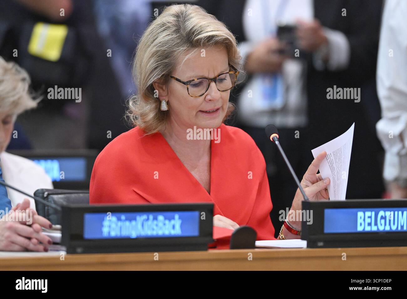 Her Majesty Mathilde (in red), Queen of the Belgians, speaks at the ...