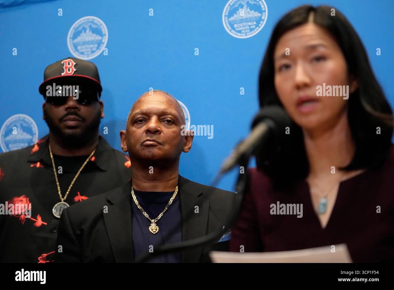 FILE - Alan Swanson, center, stands with Boston Mayor Michelle Wu ...