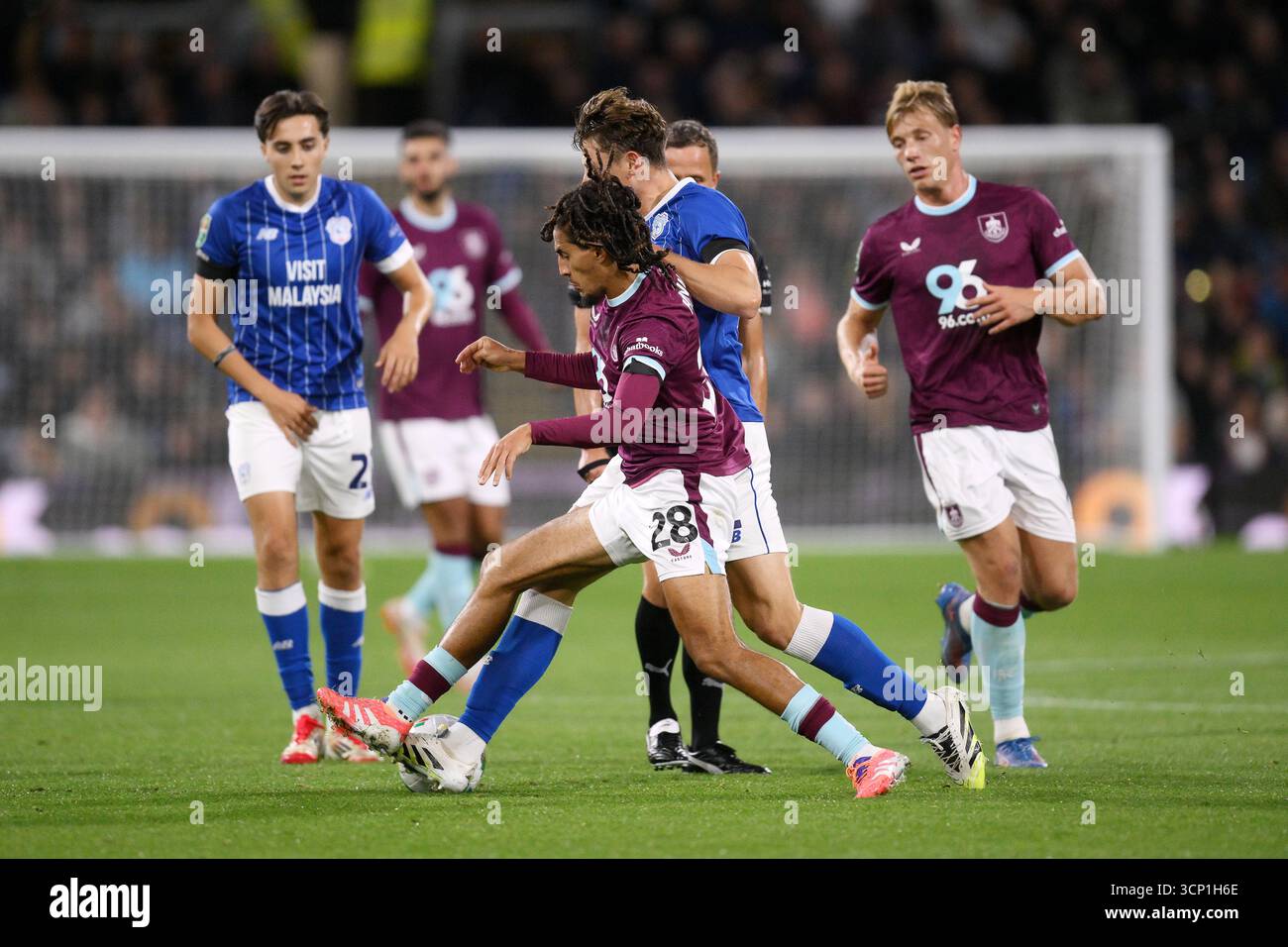 Burnley's Hannibal Mejbri (centre left) and Cardiff City's William Fish ...