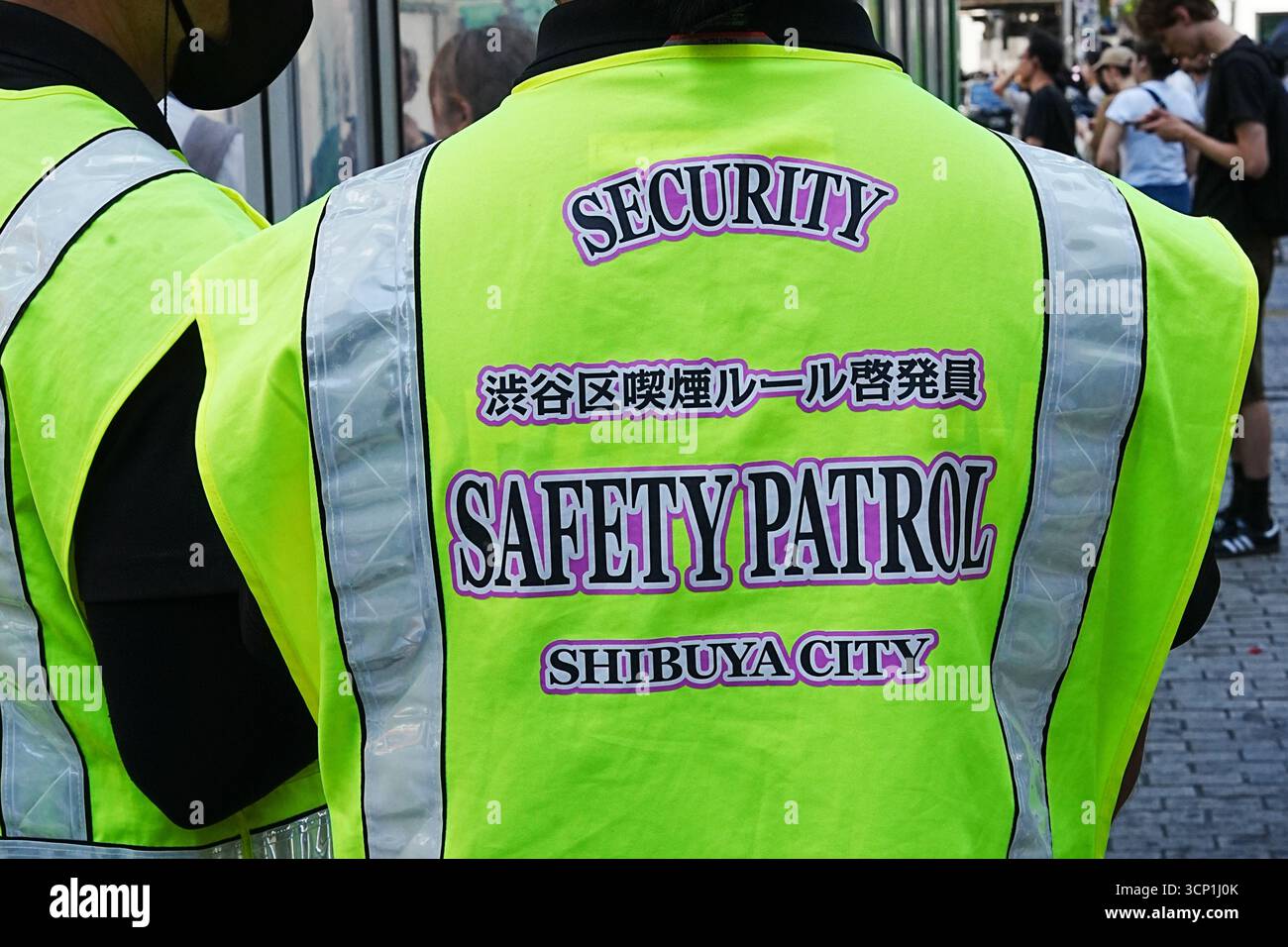 Tokyo, Japan - August 31, 2025: Two Japanese security guards conduct an ...