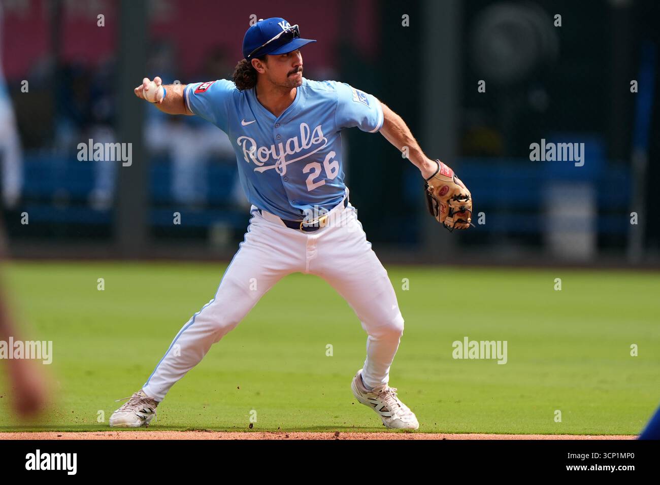 Kansas City Royals second baseman Adam Frazier throws during the first ...