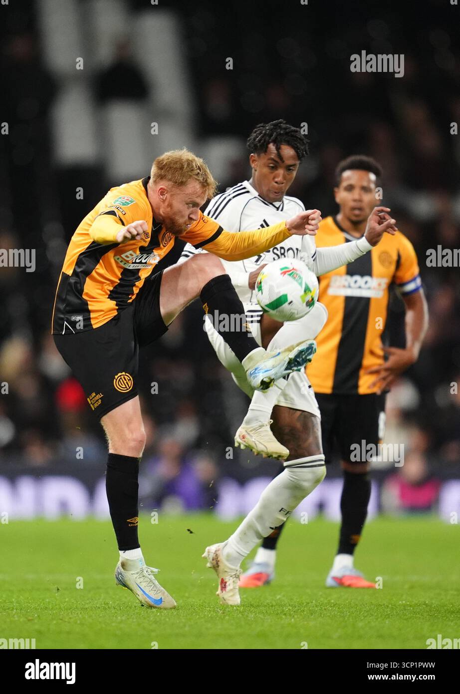 Cambridge United's James Brophy (left) and Fulham's Kevin (right ...