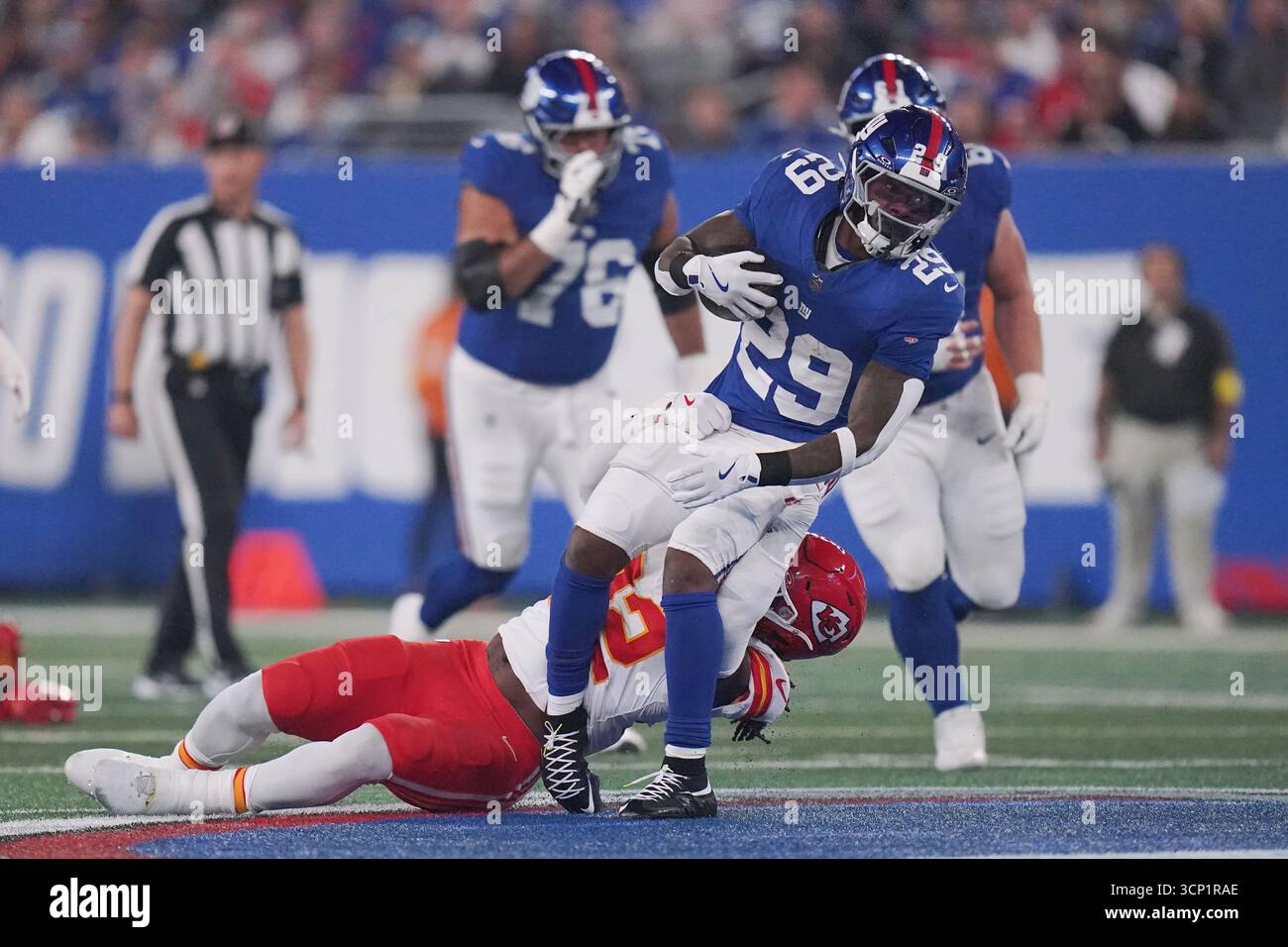 New York Giants running back Tyrone Tracy Jr. (29) gets sacked by ...
