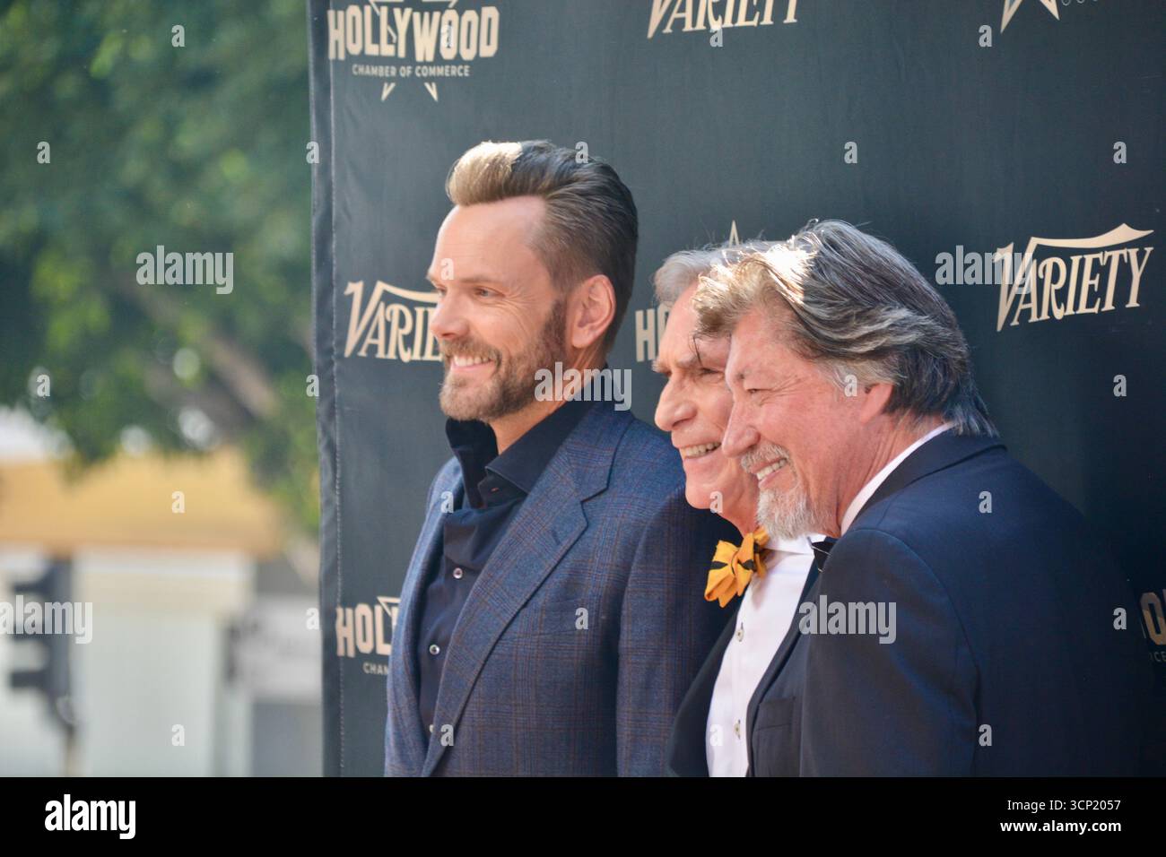 Joel McHale, Bill Nye, and Ross Shafer pose together on the step and ...