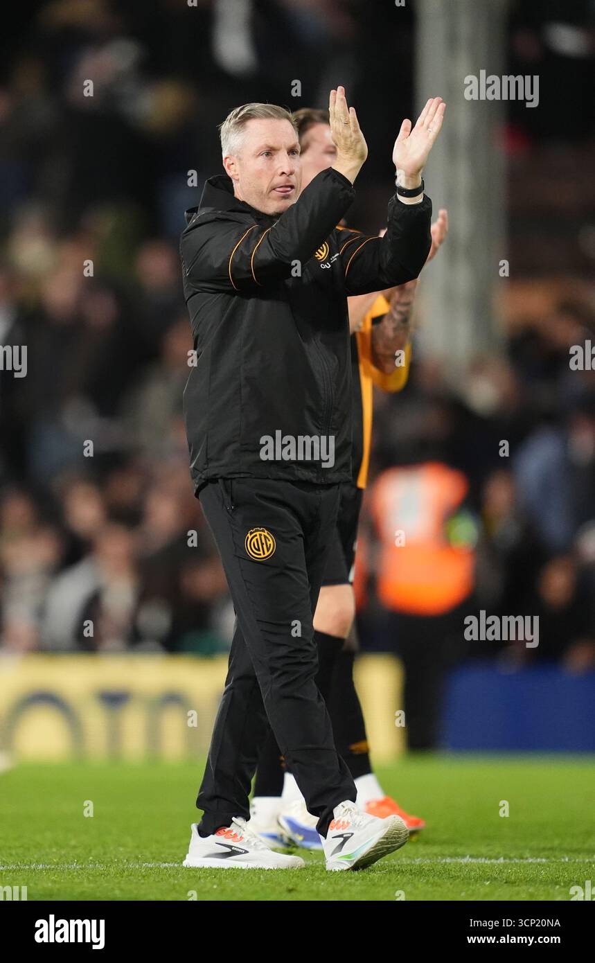 Cambridge United manager Neil Harris acknowledges the crowd at the ...