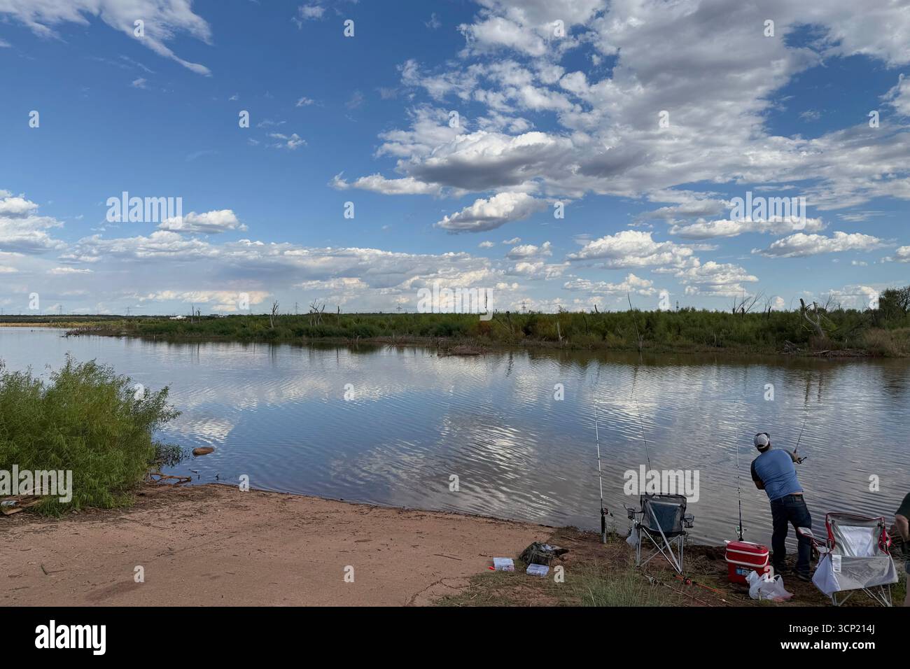 A man fishes along a creek near Lake Fort Phantom in Abilene, Texas on ...