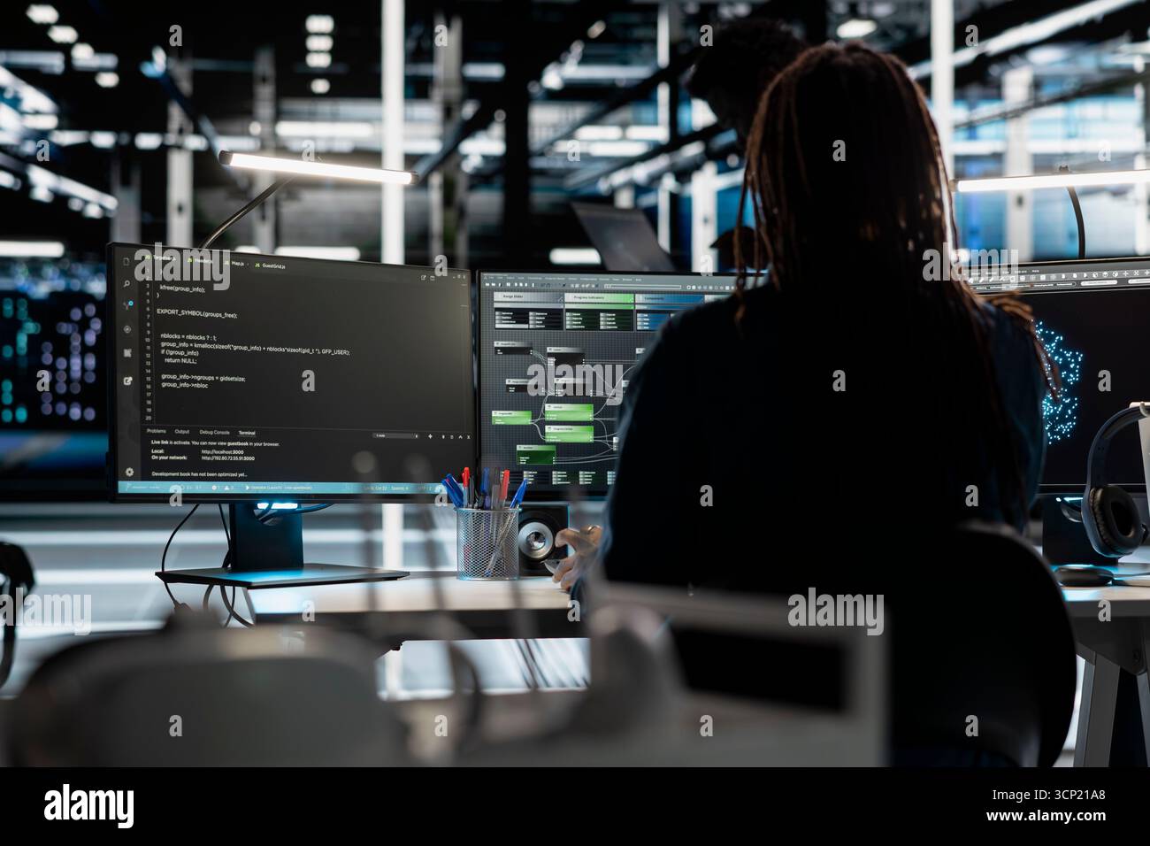 Server room programmer coding, using artificial intelligence to enhance operational efficiency ...