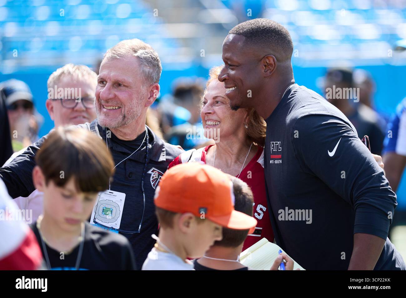 Atlanta Falcons head coach Raheem Morris takes a photo with fans prior ...