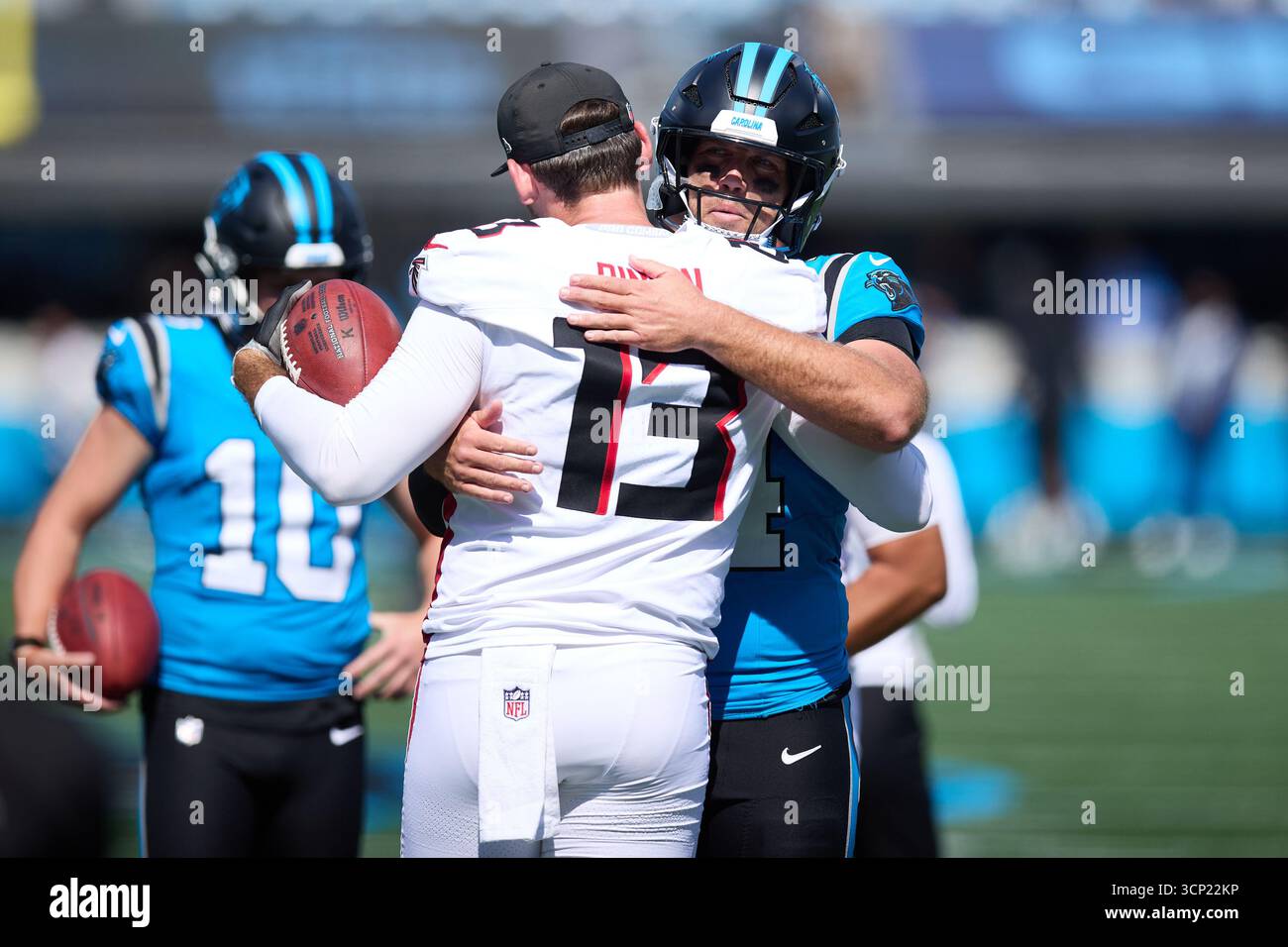 Carolina Panthers long snapper JJ. Jansen (44) hugs Atlanta Falcons ...