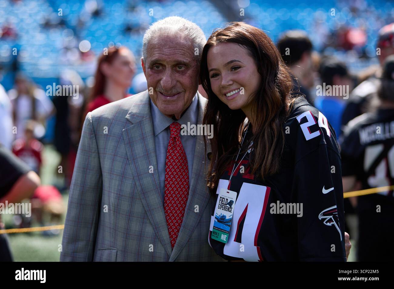 Atlanta Falcons owner Arthur Blank takes a photo with a fan prior to an ...