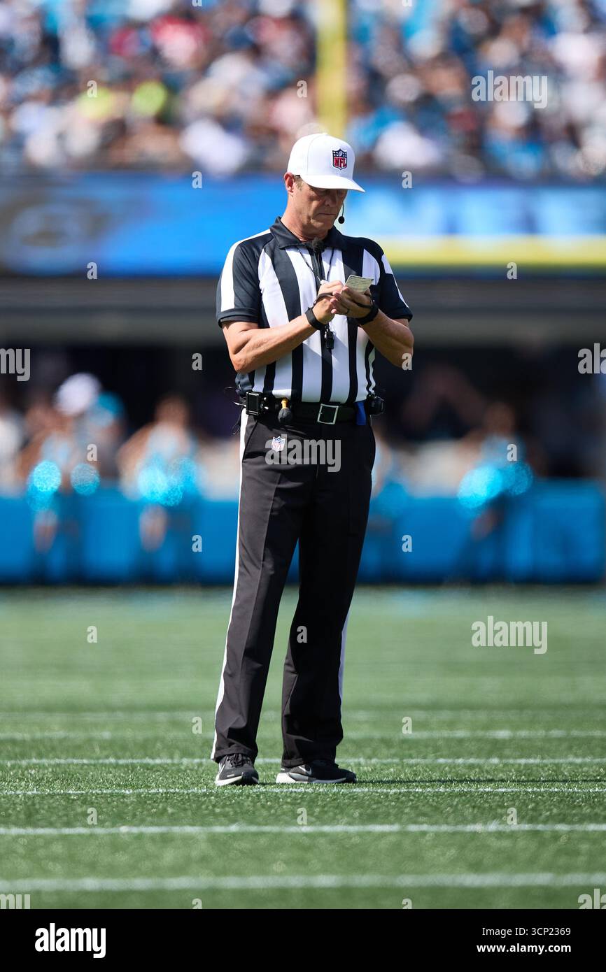Referee Craig Wrolstad (4) makes notes during an NFL football game ...