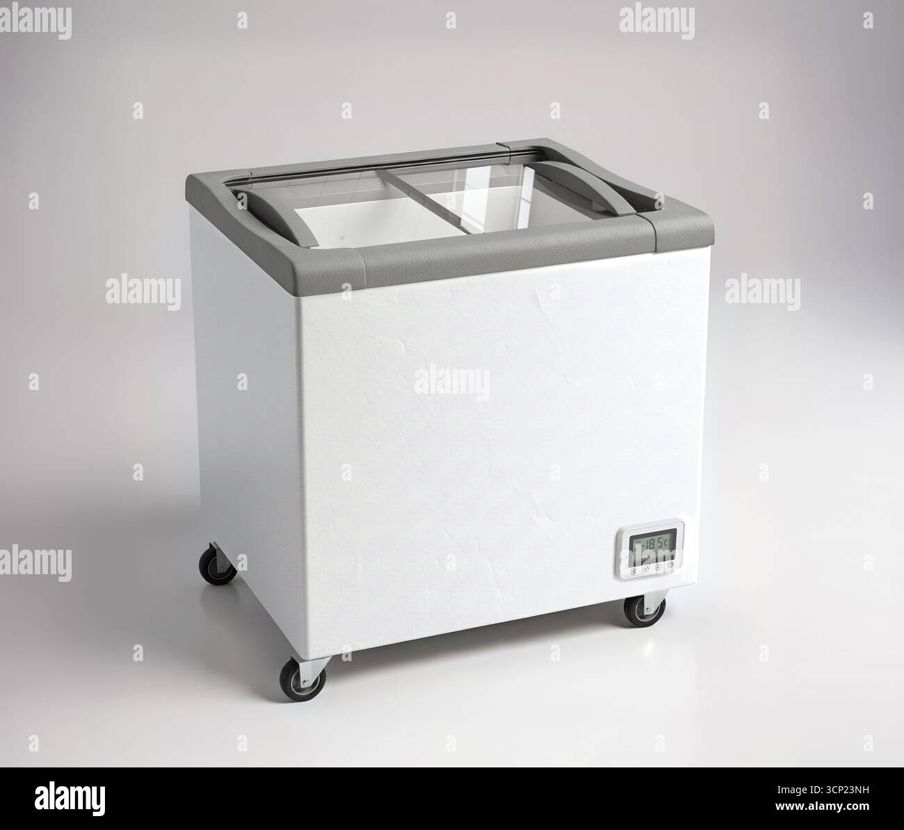 Small white freezer with top opening on white background Stock Photo ...