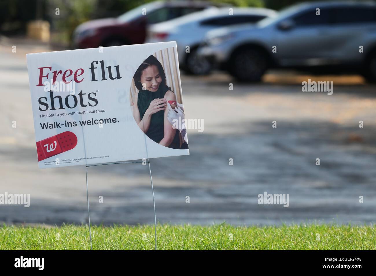 A sign for flu shots is displayed outside a Walgreens in Wheeling, Ill ...