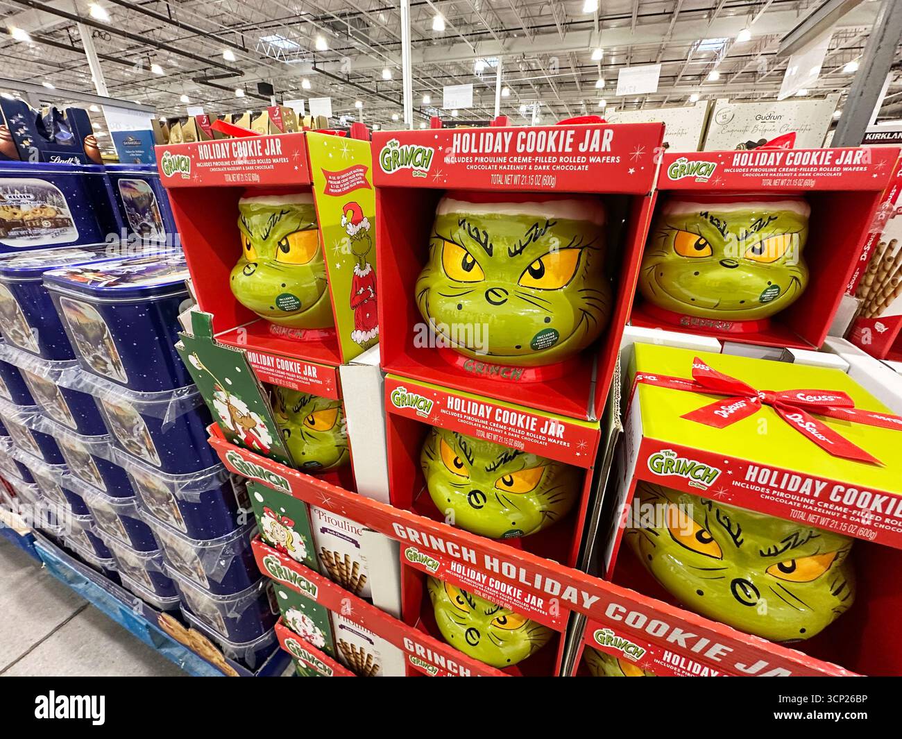 Holiday cookie jars fashioned after the caricature of the Grinch sit on ...