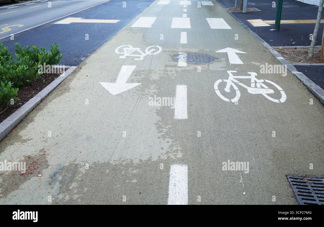 Bicycle path in Italy 2 lanes with logos Stock Photo - Alamy
