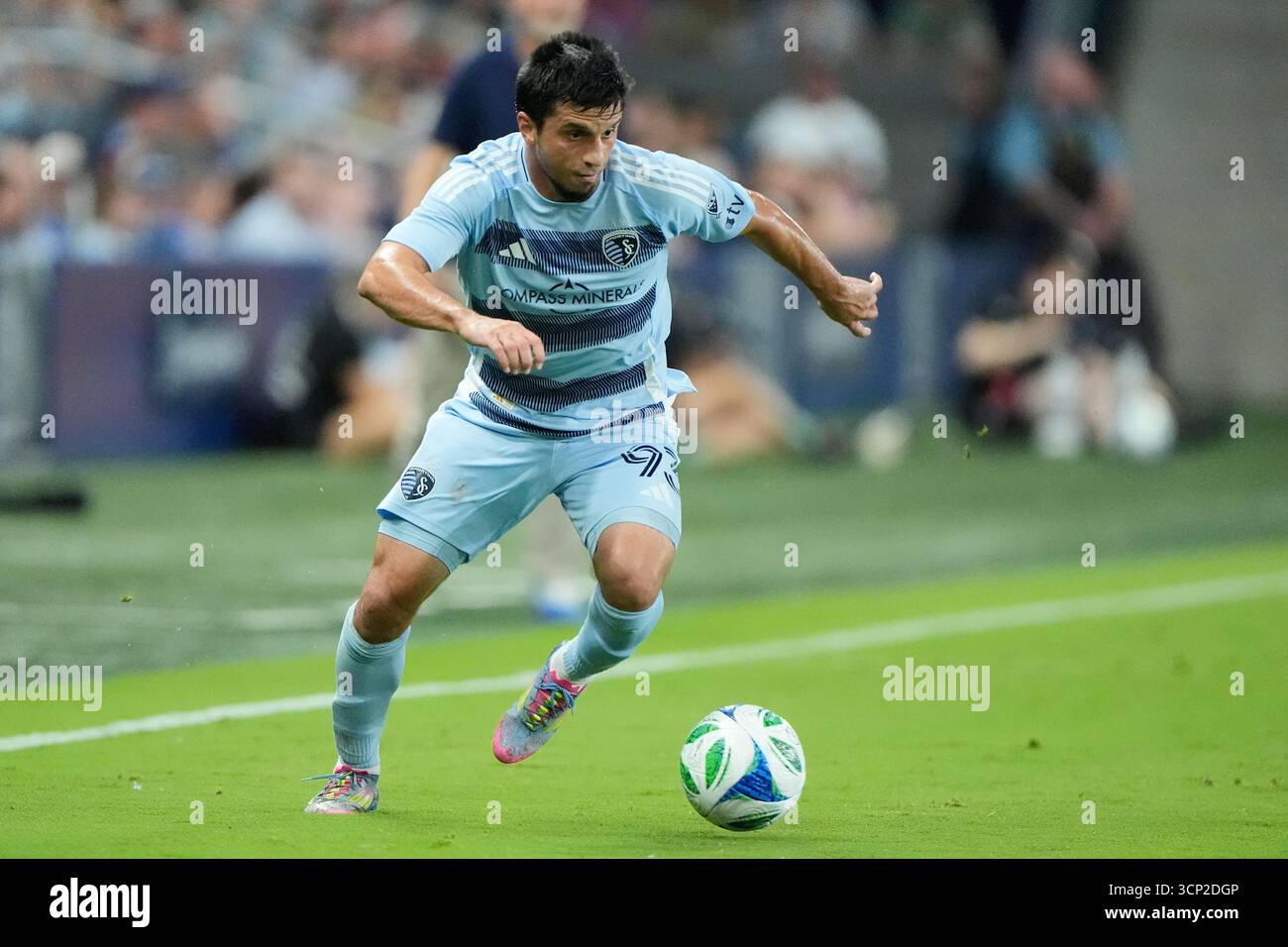 Sporting Kansas City midfielder Magomed Suleymanov moves the ball during the first half of an ...