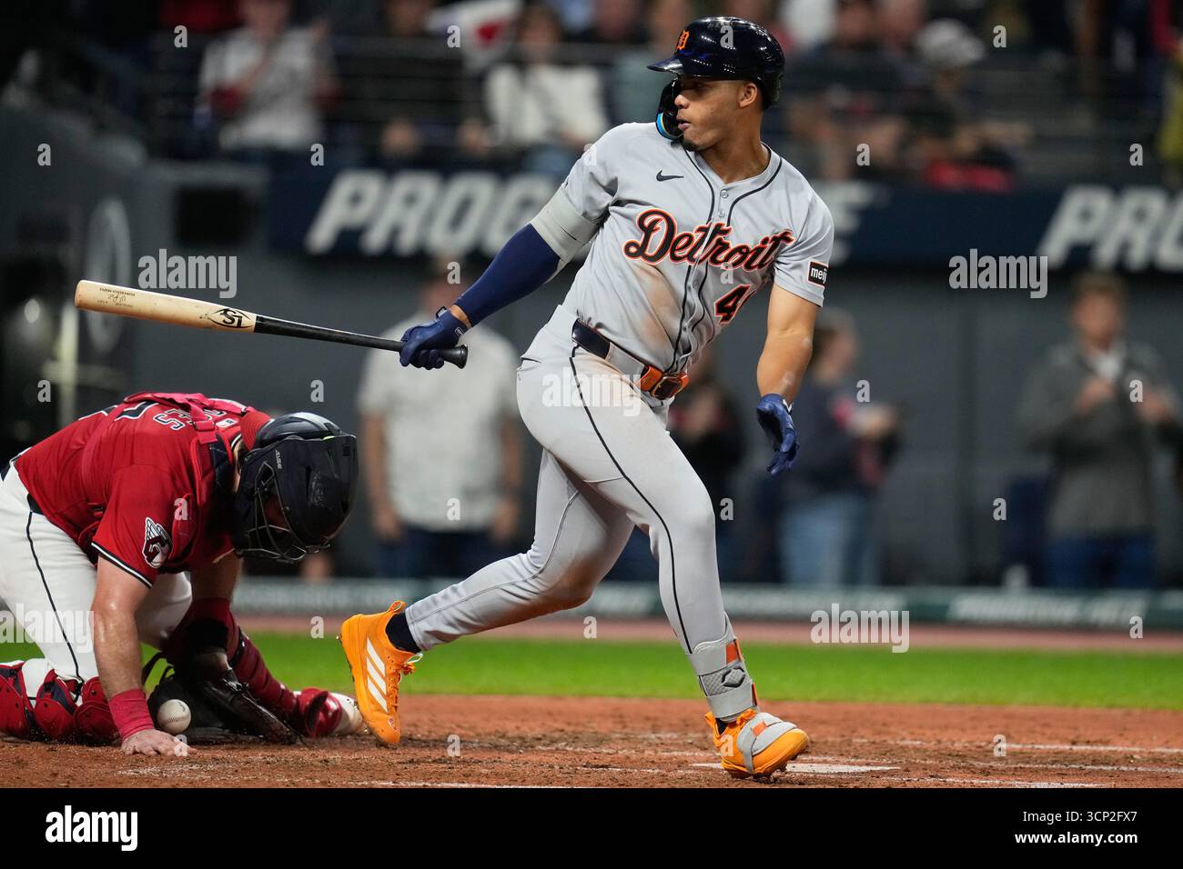 Cleveland Guardians catcher Austin Hedges, left, reaches for the ball ...