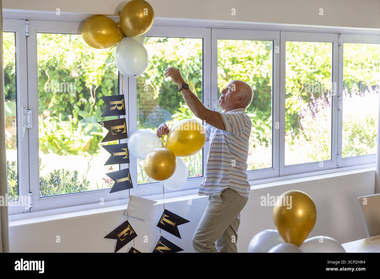 Adjusting decorations hi-res stock photography and images - Alamy