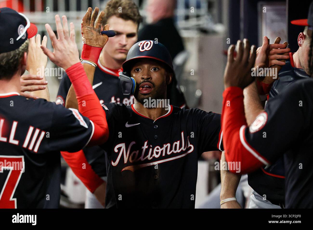 Washington Nationals' Nasim Nuñez high-fives teammates in the dugout ...