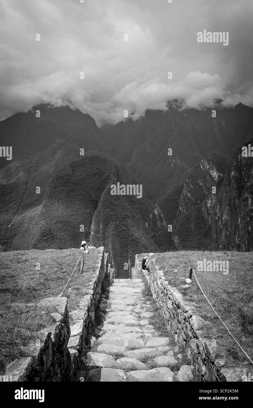 Inca stone staircase in Machu Picchu, ascending to the sky, steep and ...