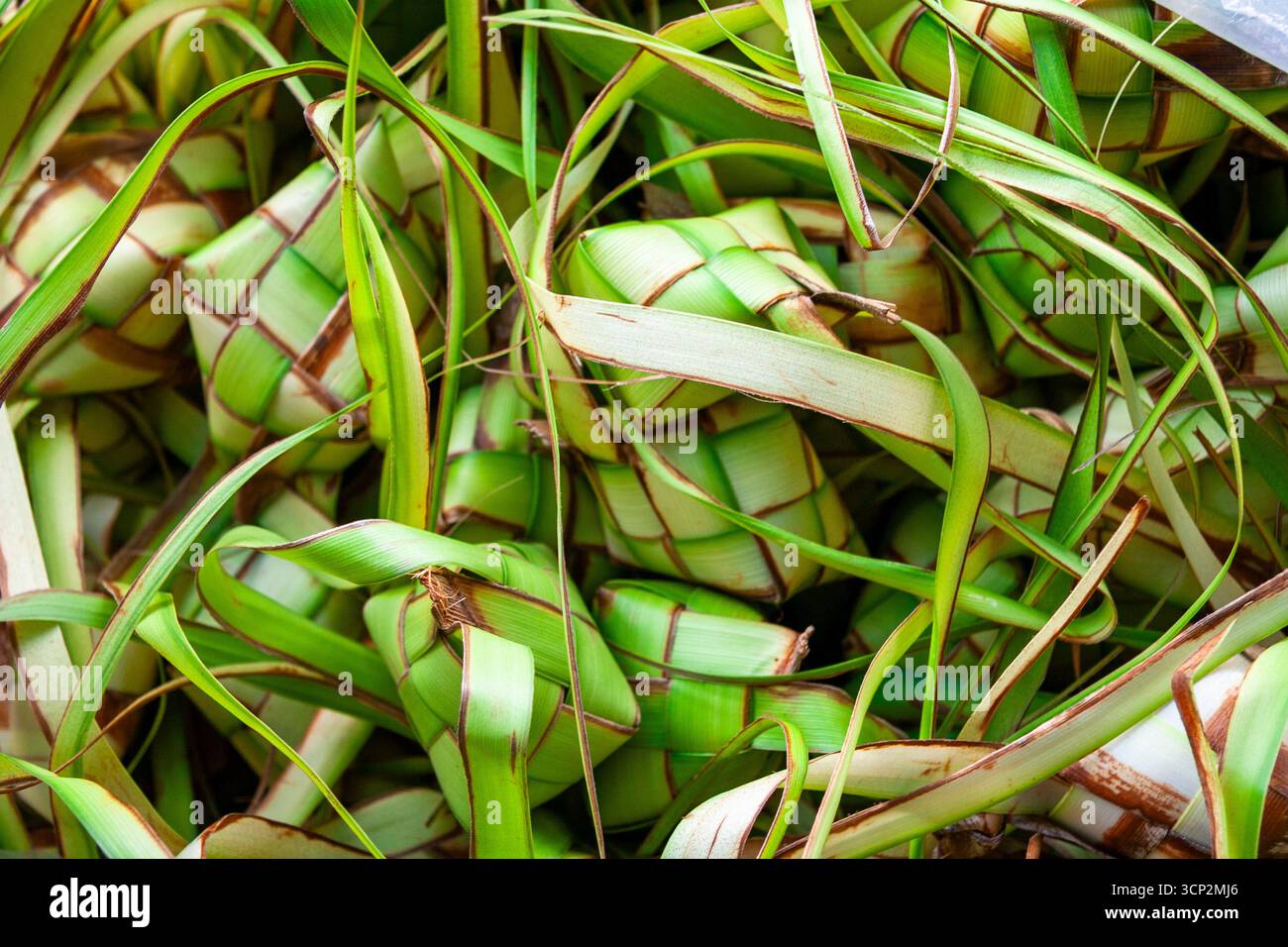 Puso, or hanging rice, a traditional Cebuano dish similar to ketupat ...