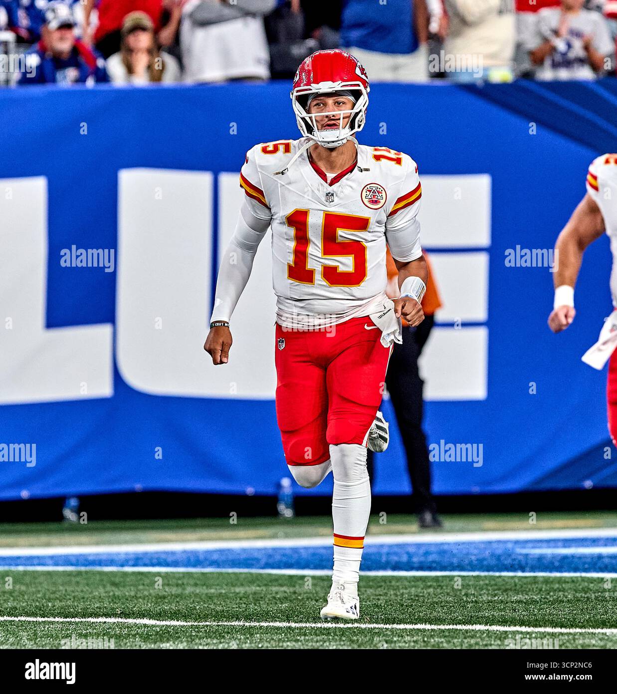 Kansas City Chiefs quarterback Patrick Mahomes (15) runs onto the field ...