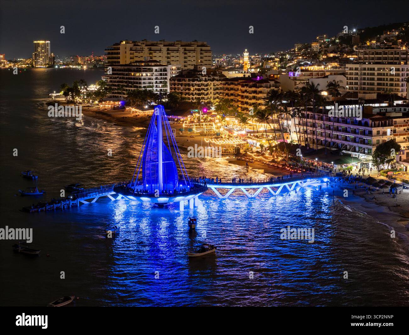 Night aerial view of Los Muertos Pier with fireworks in Puerto Vallarta ...