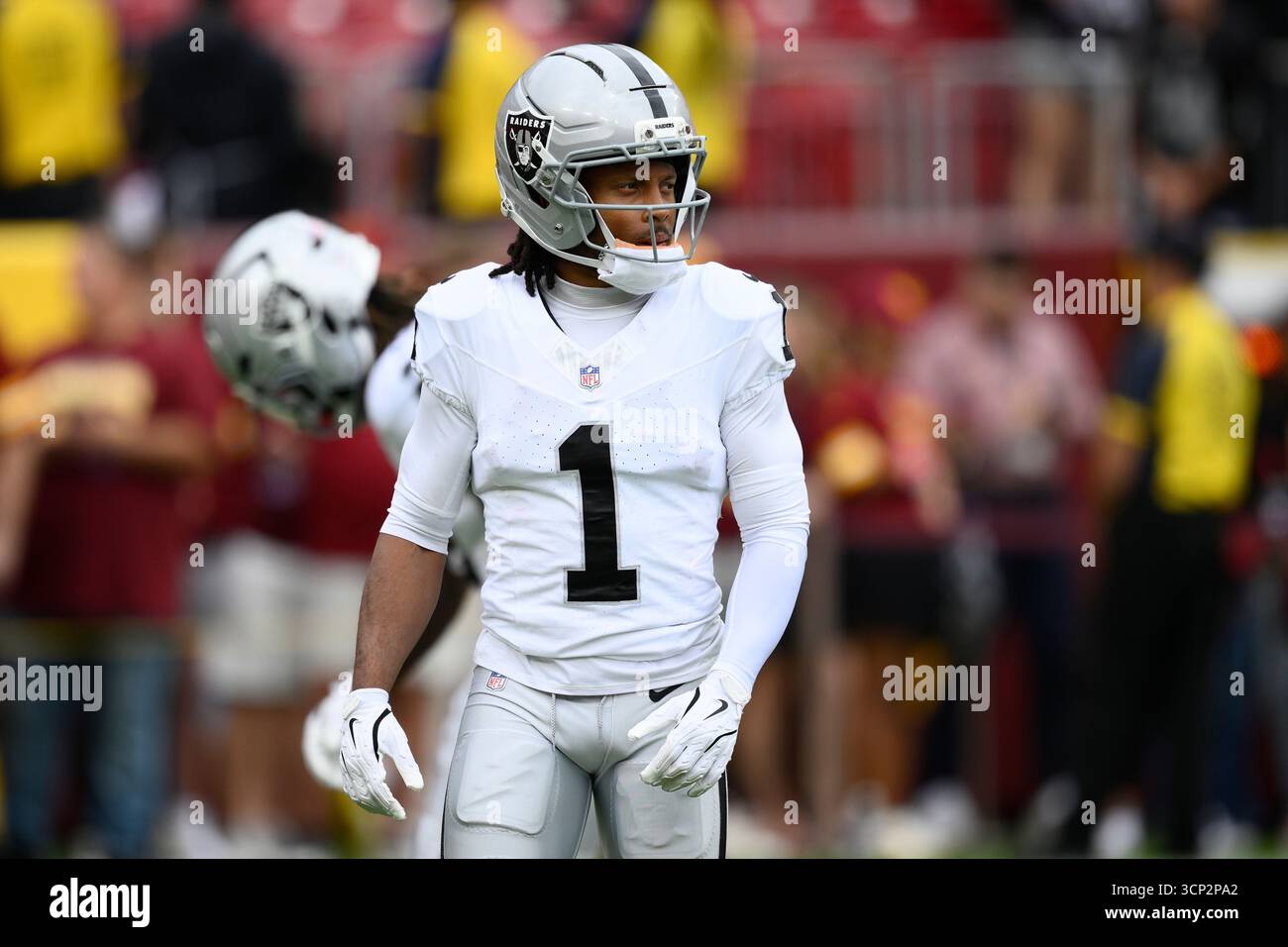 Las Vegas Raiders wide receiver Tre Tucker (1) warms up before an NFL ...