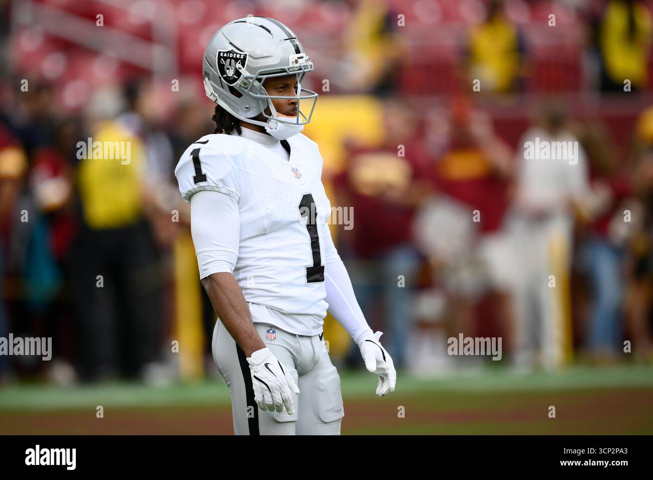 Las Vegas Raiders wide receiver Tre Tucker (1) warms up before an NFL ...