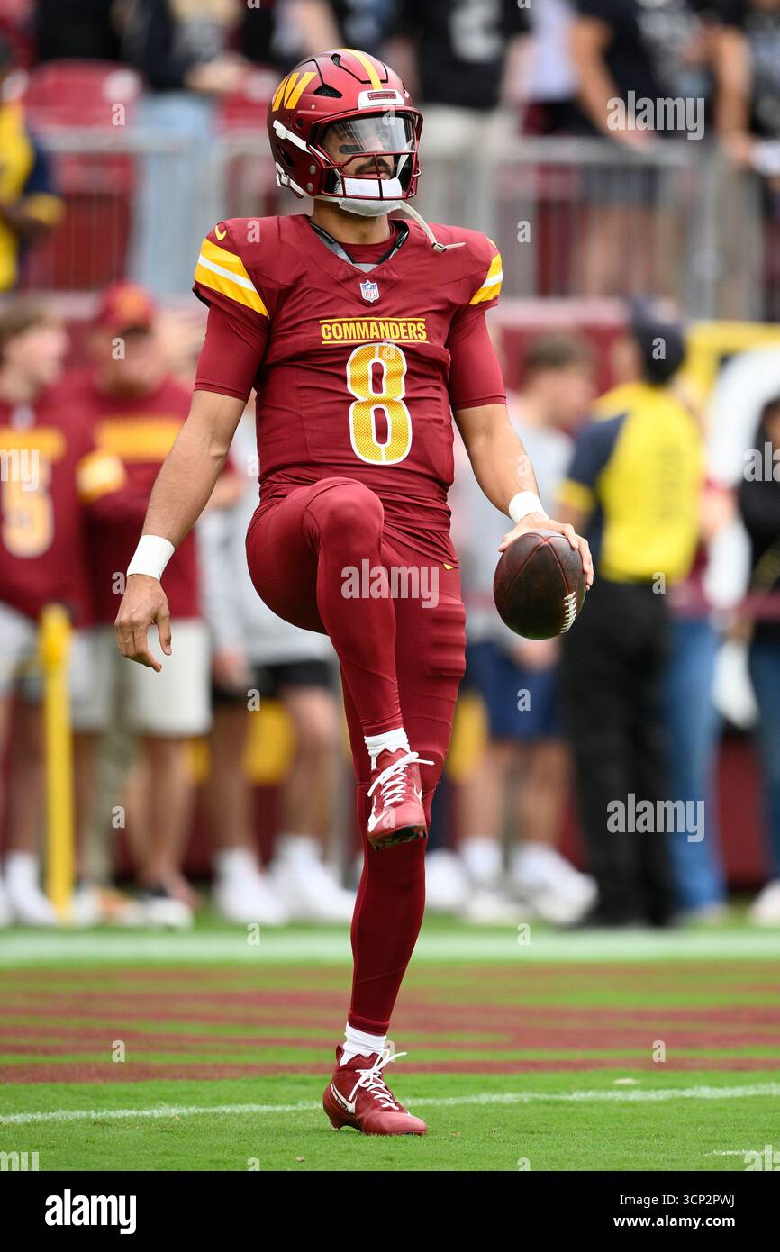 Washington Commanders quarterback Marcus Mariota (8) warms up before an ...