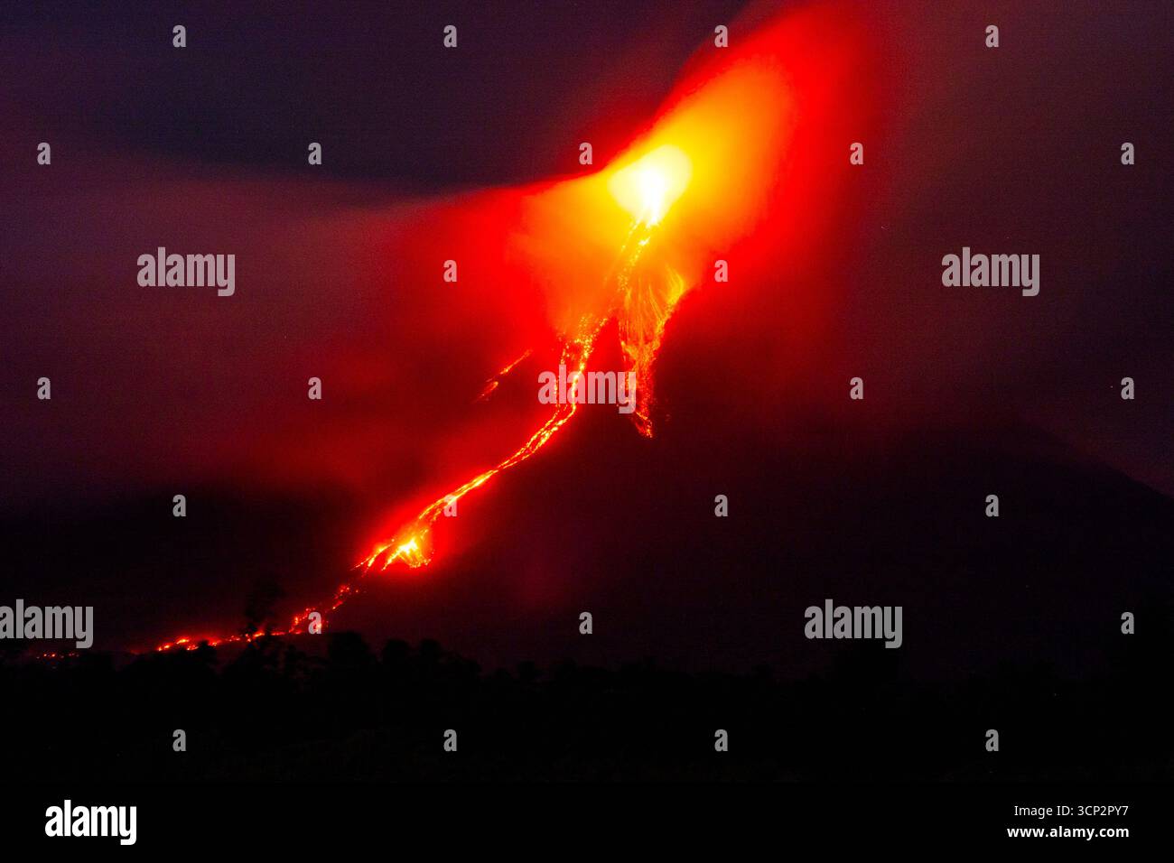 glowing lava flow during an eruption of mayon volcano at night in albay ...
