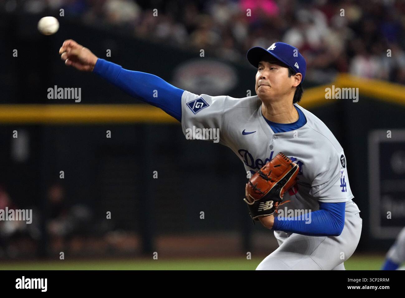 Los Angeles Dodgers pitcher Shohei Ohtani throws against the Arizona ...