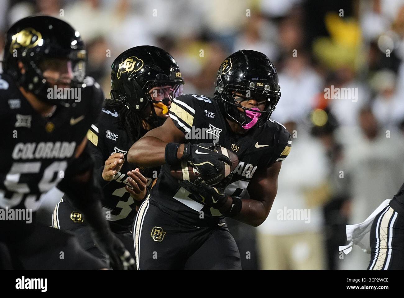 Colorado running back Micah Welch (29) runs for a short gain against ...