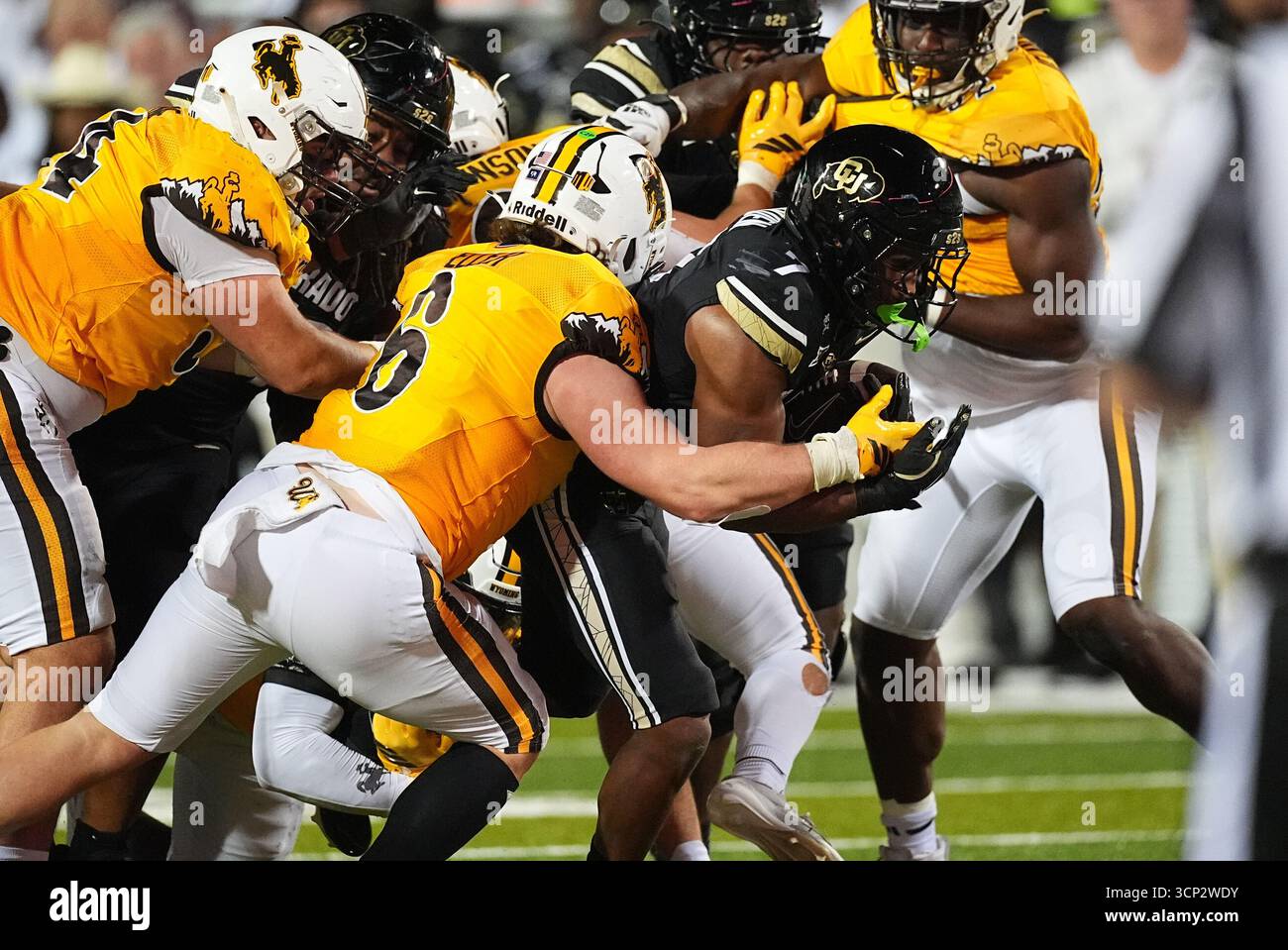 Colorado running back Dallan Hayden (7) is stopped by Wyoming ...