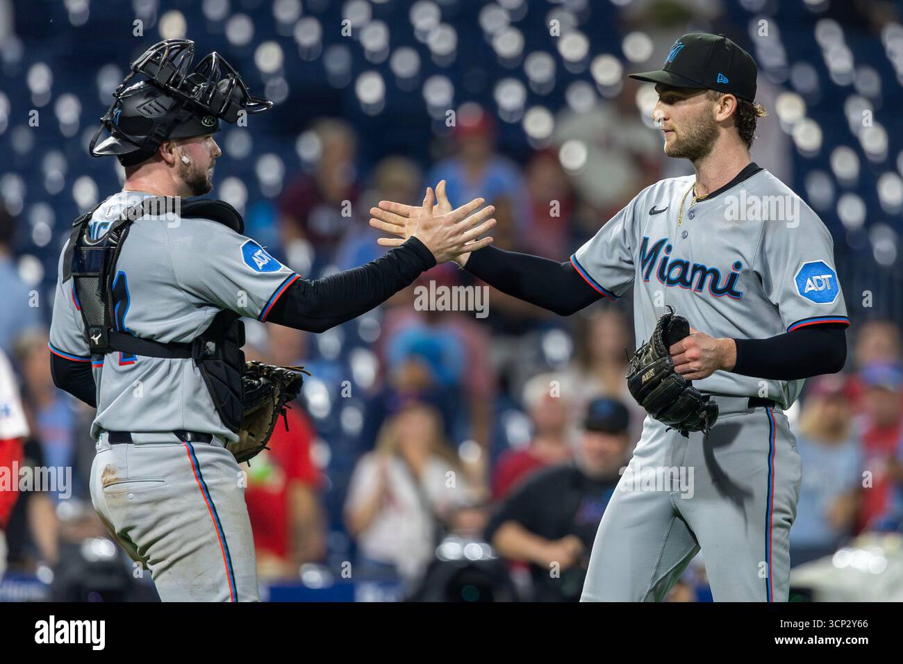 Miami Marlins closing pitcher Josh Simpson, right, and catcher Liam ...